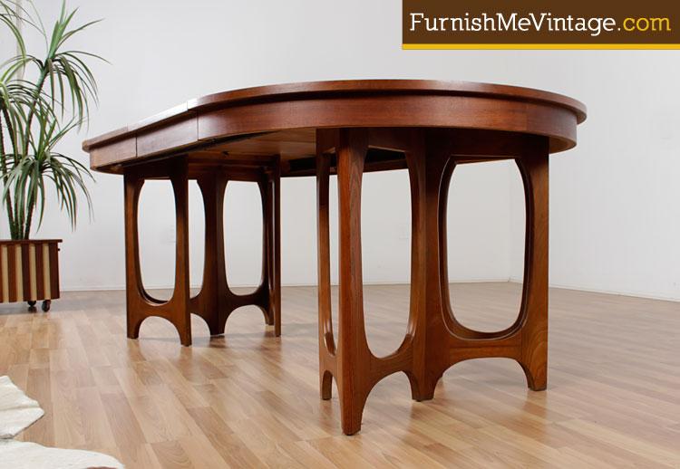 Mid century modern walnut dining table with arched leg